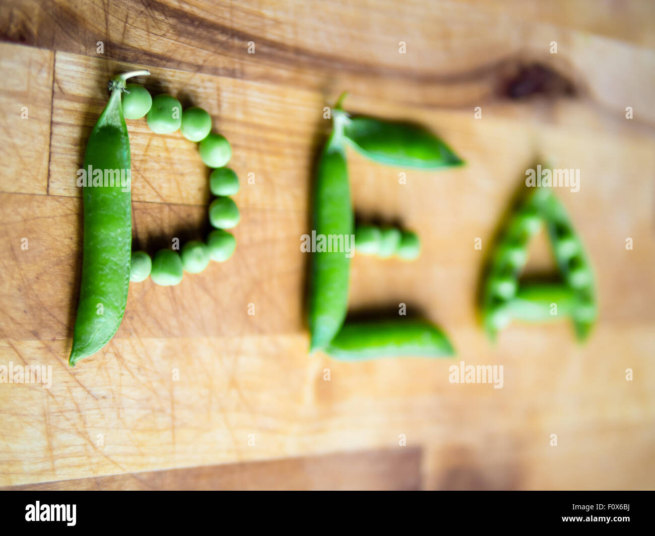 Word PEA written with peas Stock Photo - Alamy