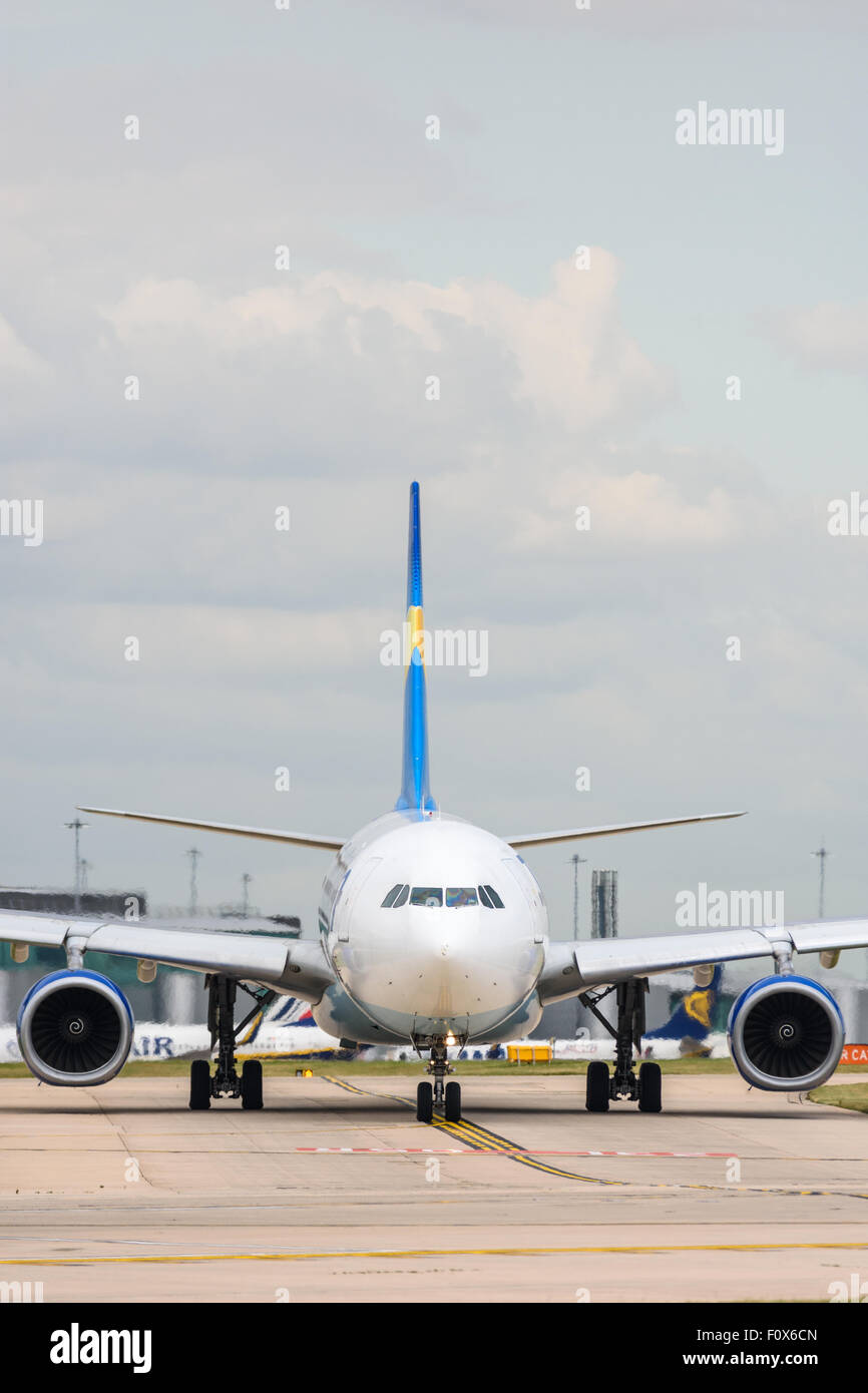 Head on view of a Thomas Cook Airbus A330-200 aeroplane travelling to ...