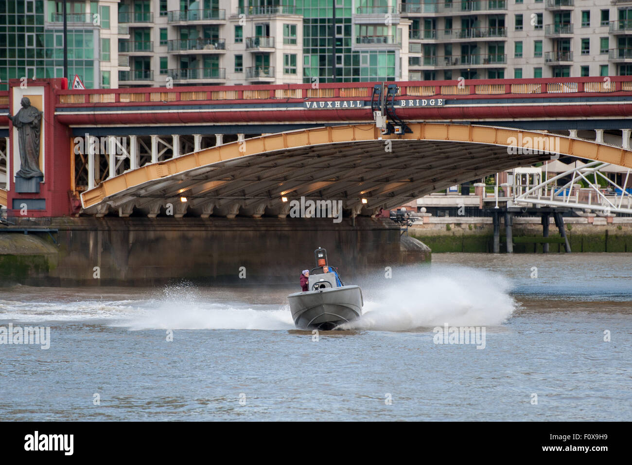 A military style boat in front of the MI6 building during filming of ...