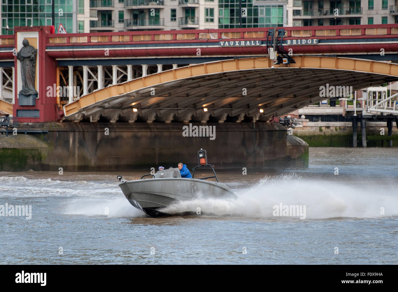 A military style boat in front of the MI6 building during filming of ...