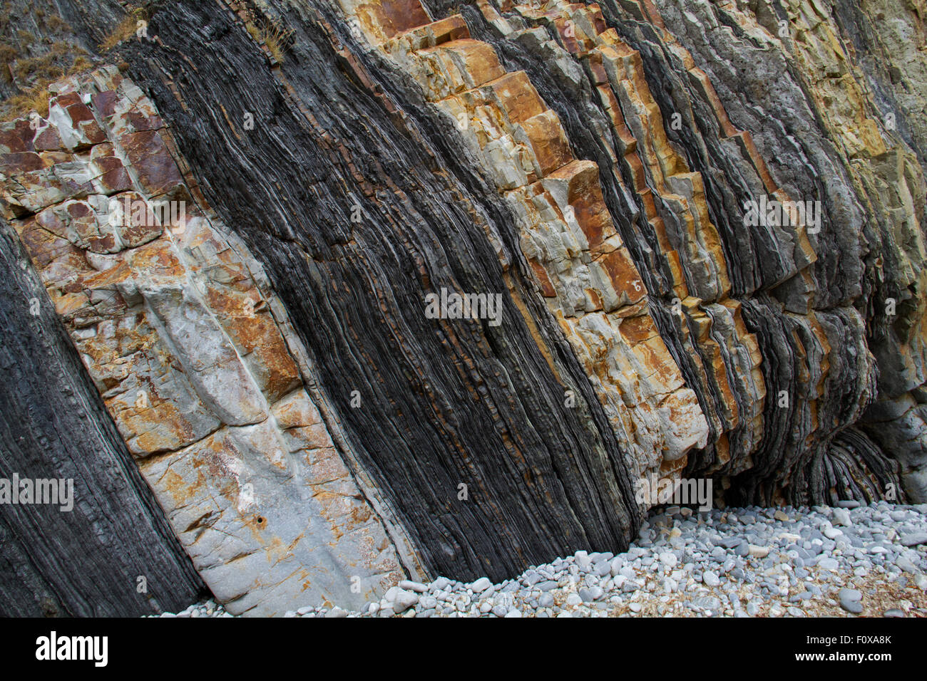 Layered and folded rock in a cliff on the coast of Brittany, France ...