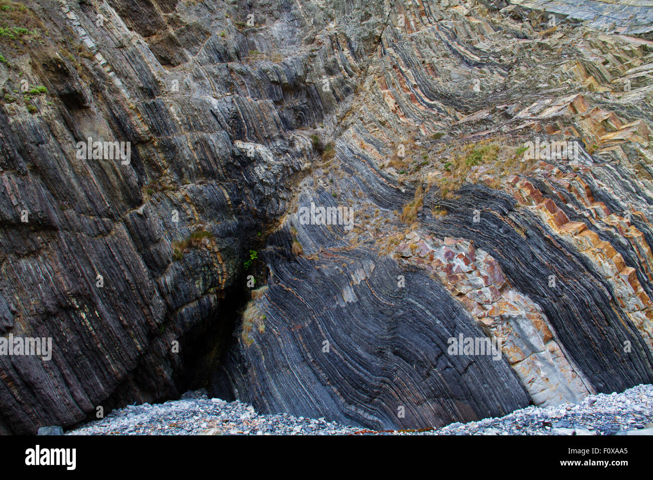 Layered and folded rock in a cliff on the coast of Brittany, France ...
