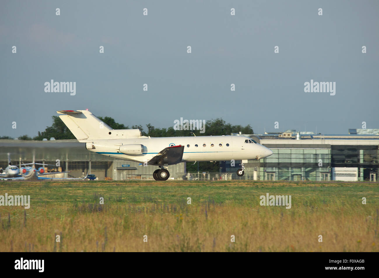 Regional or business jet is taking off from the runway in the airport ...