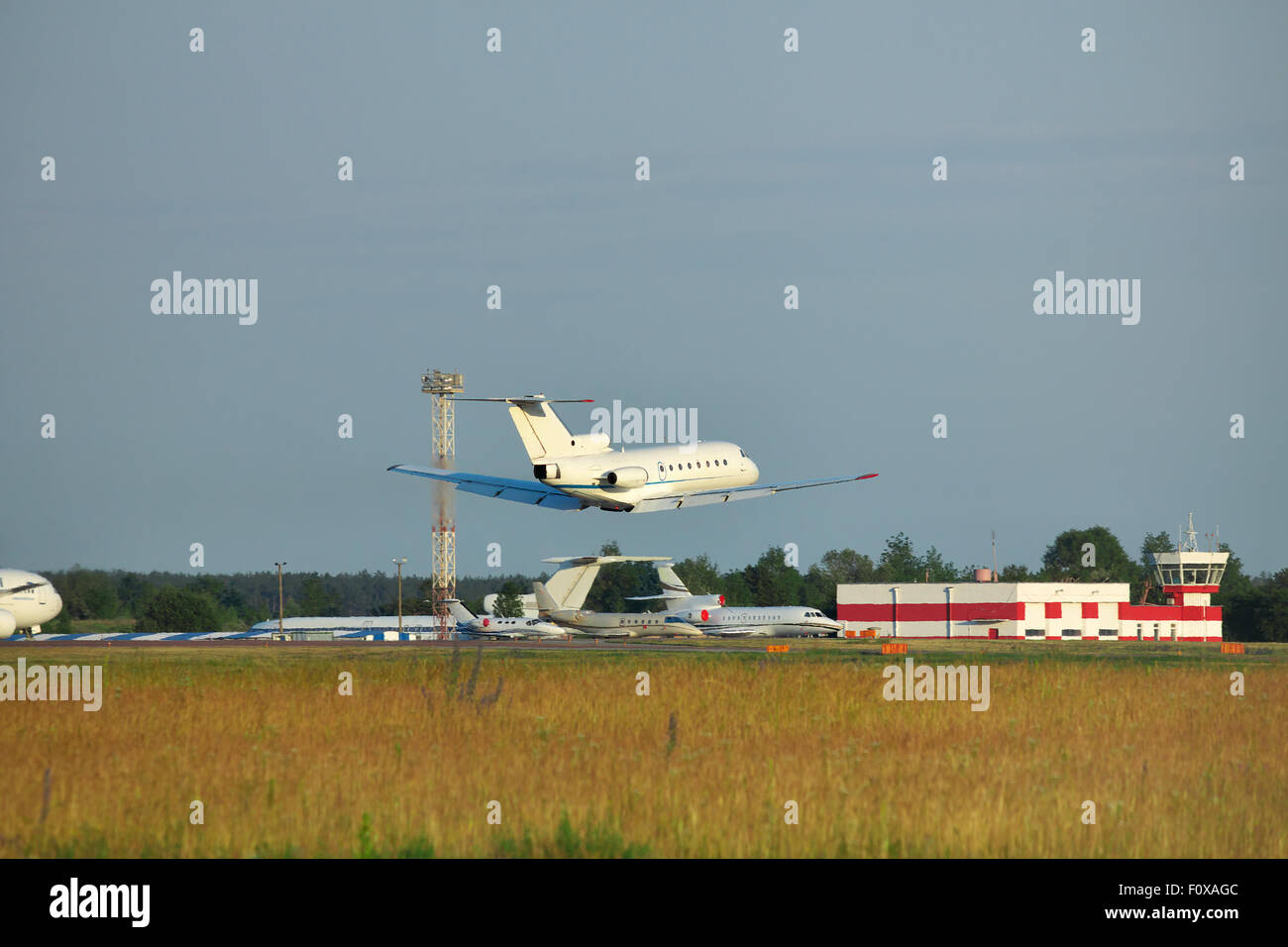 Regional or business jet is taking off from the runway in the airport ...