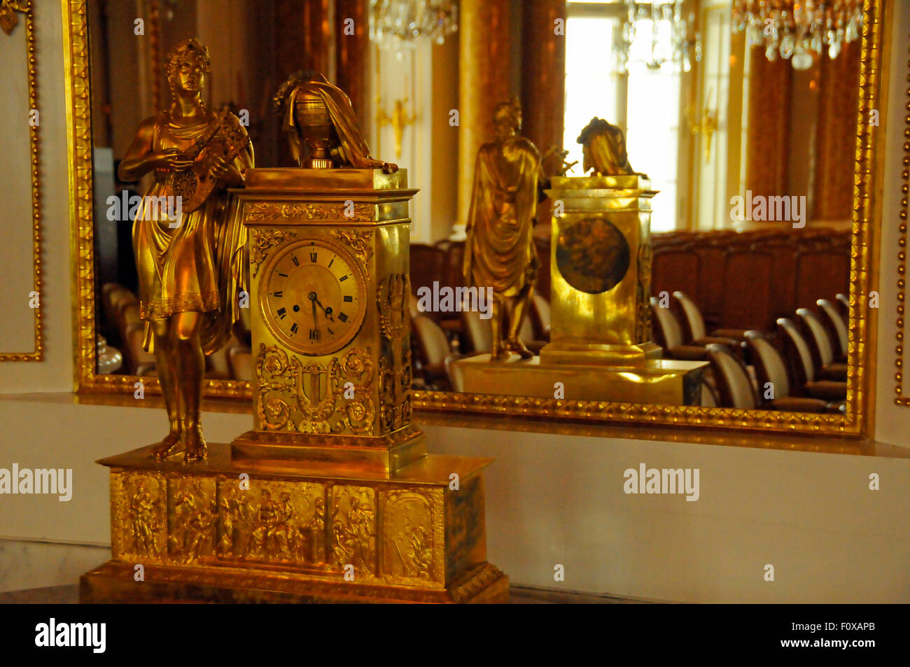 Gold ornamental clock at Royal Castle in Warsaw, Poland Stock Photo - Alamy