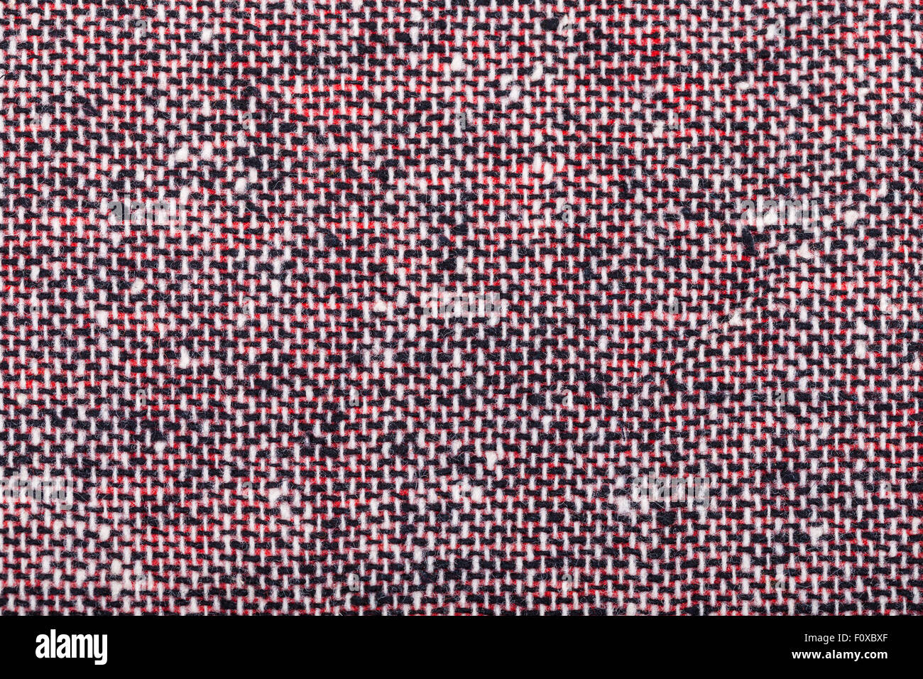 background from red black and white woolen neps fabric close up Stock ...