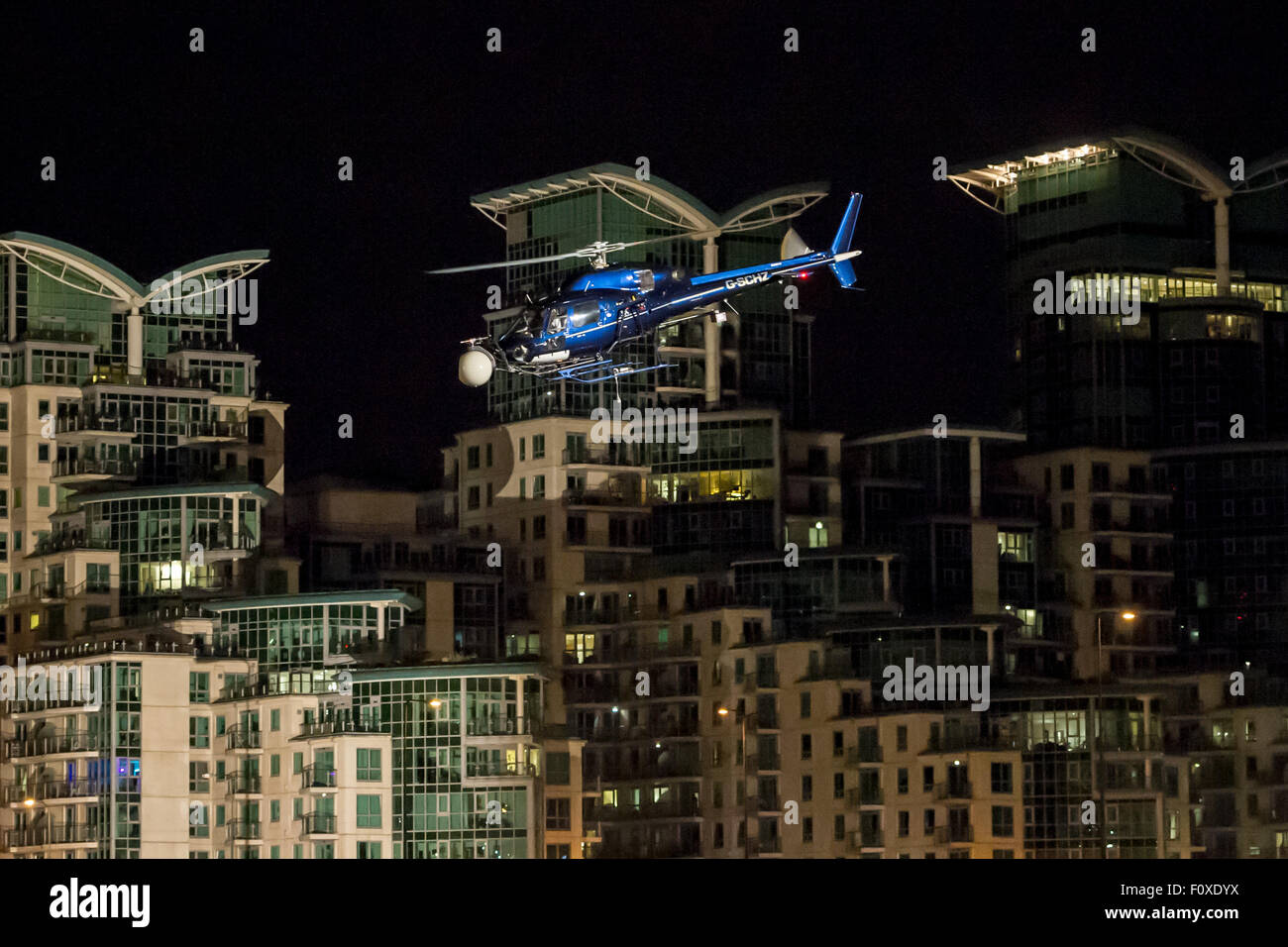 A helicopter flies over the River Thames as a boat containing body ...