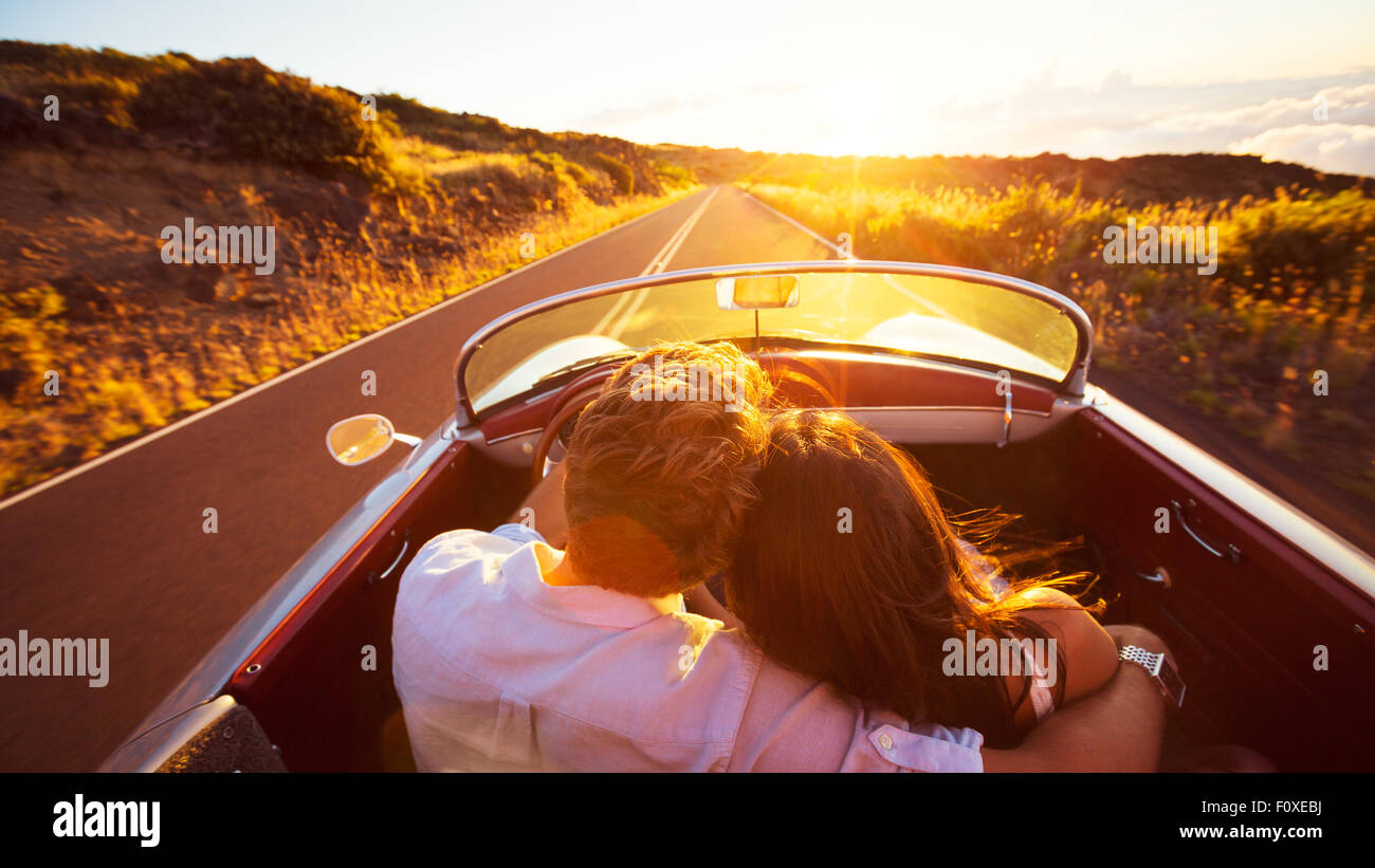 Driving into the Sunset. Romantic Young Couple Enjoying Sunset Drive in ...