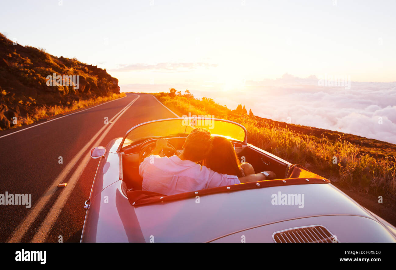 Romantic Couple Driving into the Sunset in Classic Vintage Sports Car ...