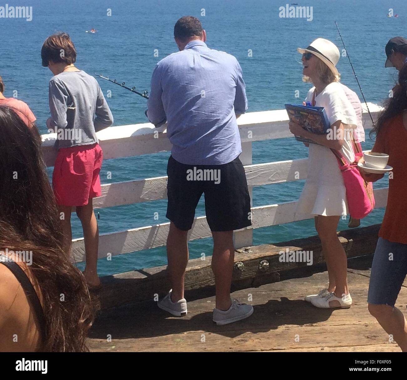 Naomi Watts and husband Liev Schreiber go fishing off a pier in Malibu ...