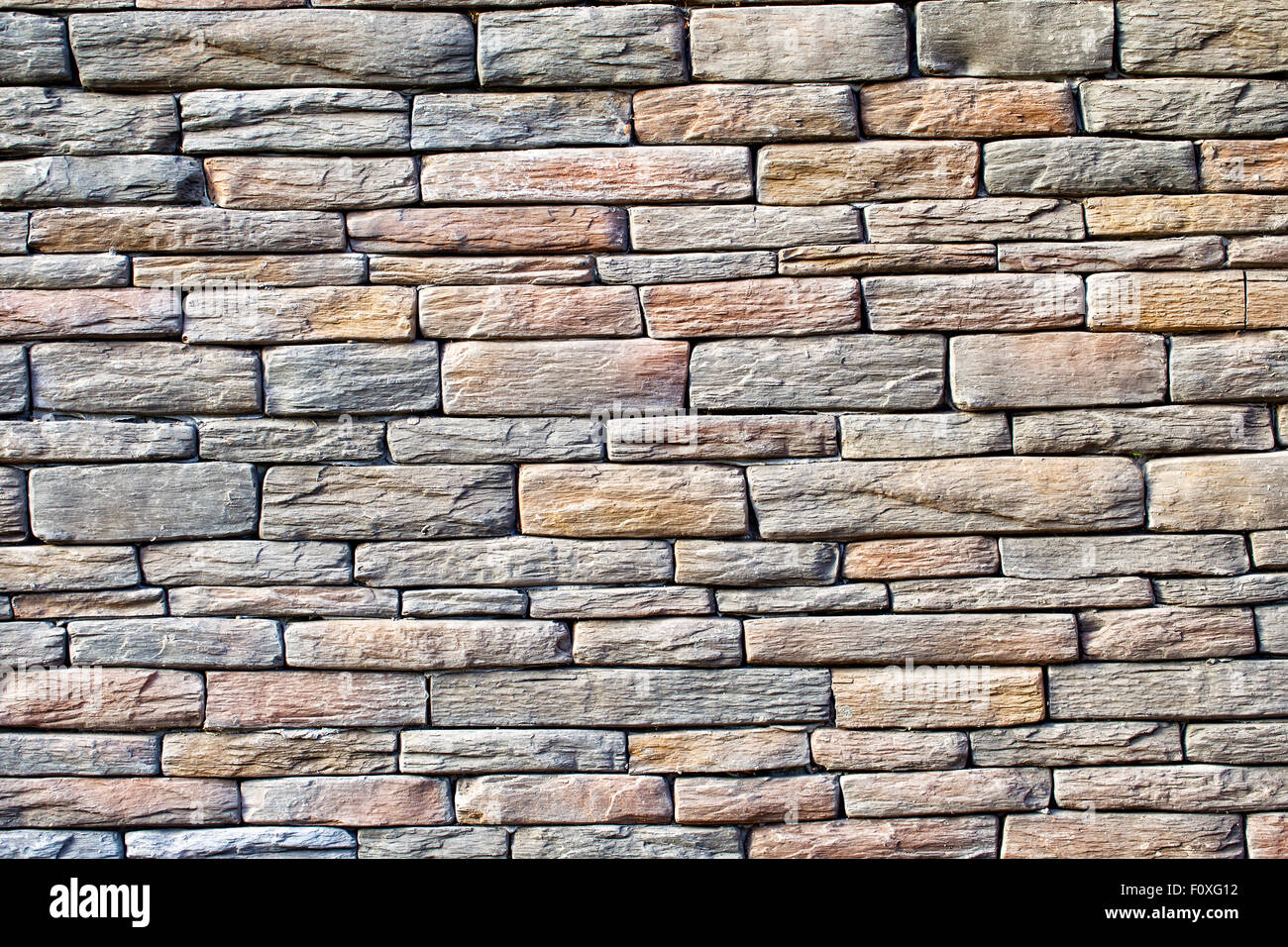 Background of colored rough solid stone arranged in layers Stock Photo ...