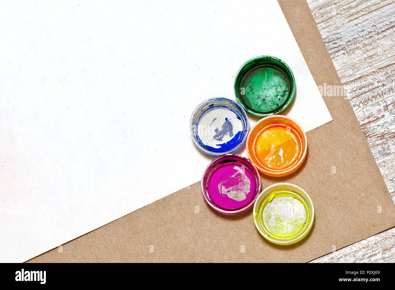 Colorful gouache on a sheet of paper. Tools of the artist. The creative ...