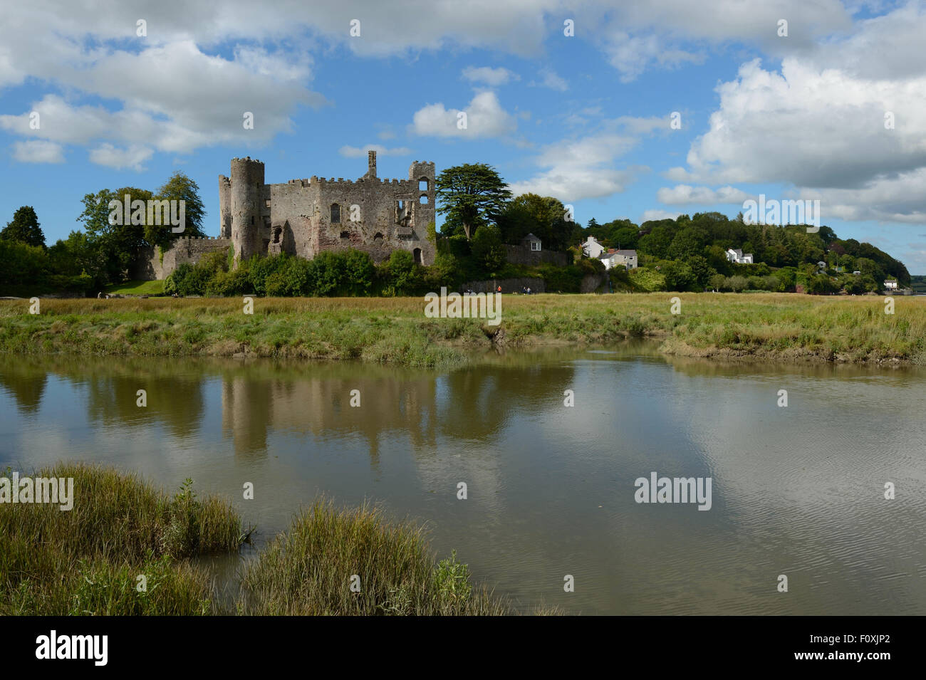 laugharne castle at high tide Stock Photo - Alamy