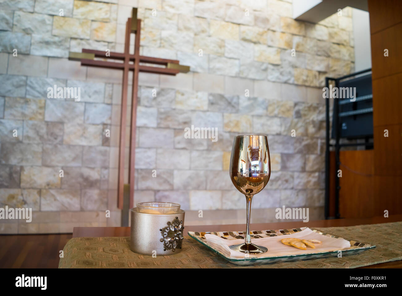 Silver communion cup with bread and the cross in the church nave Stock ...