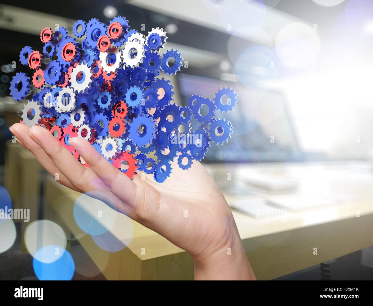 businessman hand showing gears cogs to success concept Stock Photo - Alamy