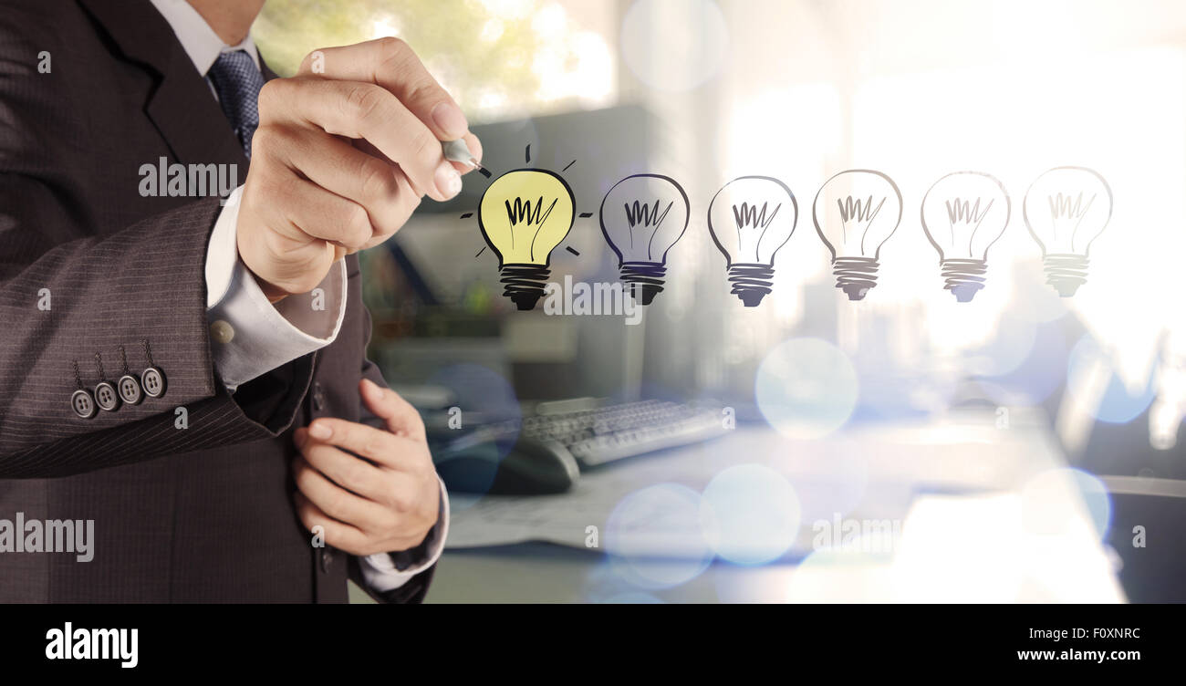businessman hand drawing creative business strategy with light bulb as ...