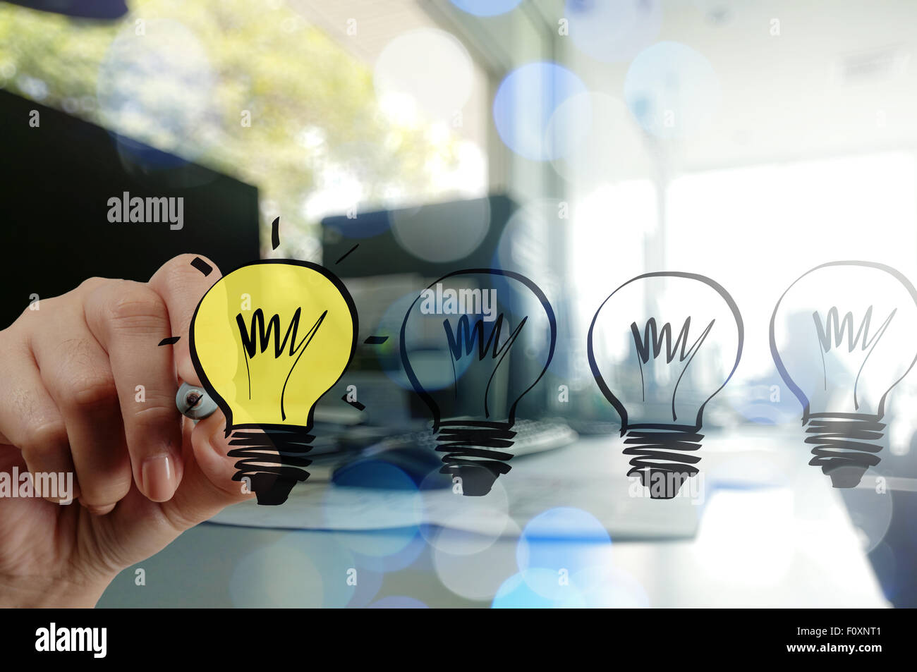 businessman hand drawing creative business strategy with light bulb as ...