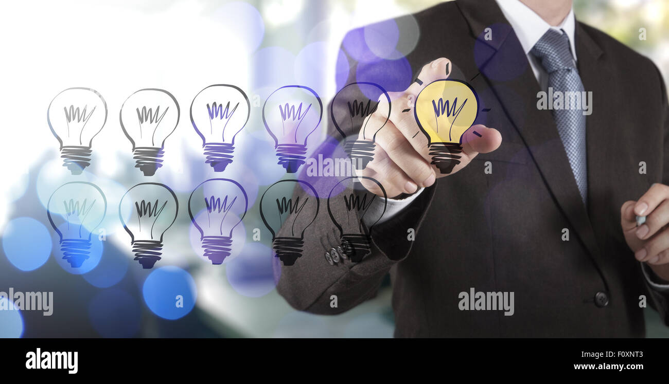 businessman hand drawing creative business strategy with light bulb as ...