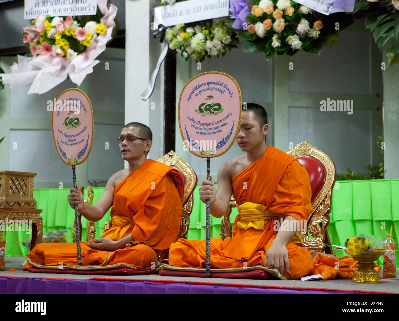 Monks chant during funeral services for Yutnarong Singro at Wat Bangna ...