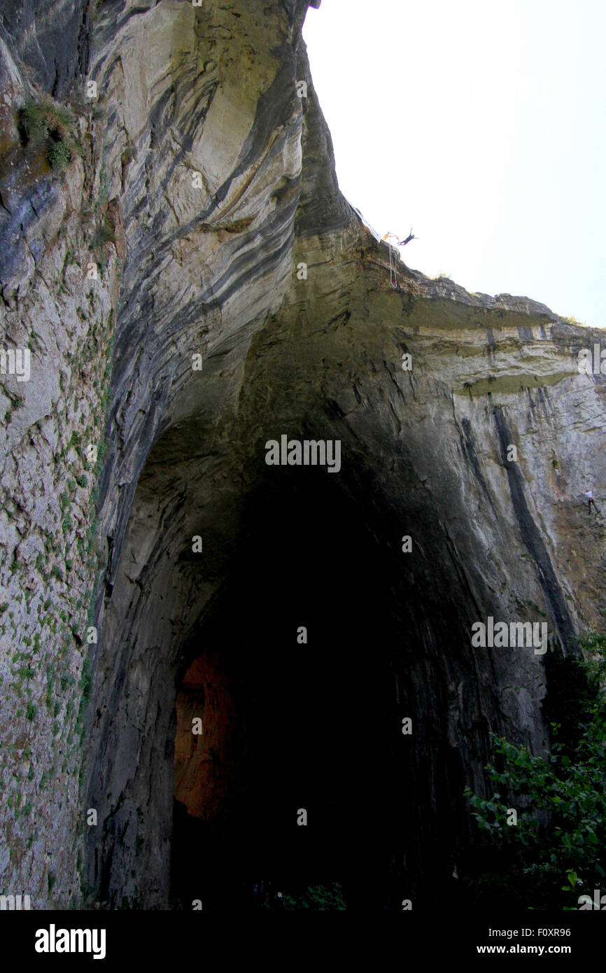 Bungee jumpers hurl themselves over the Prohodna cave entrance and ...