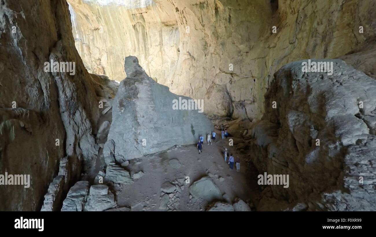 Bungee jumpers hurl themselves over the Prohodna cave entrance and ...