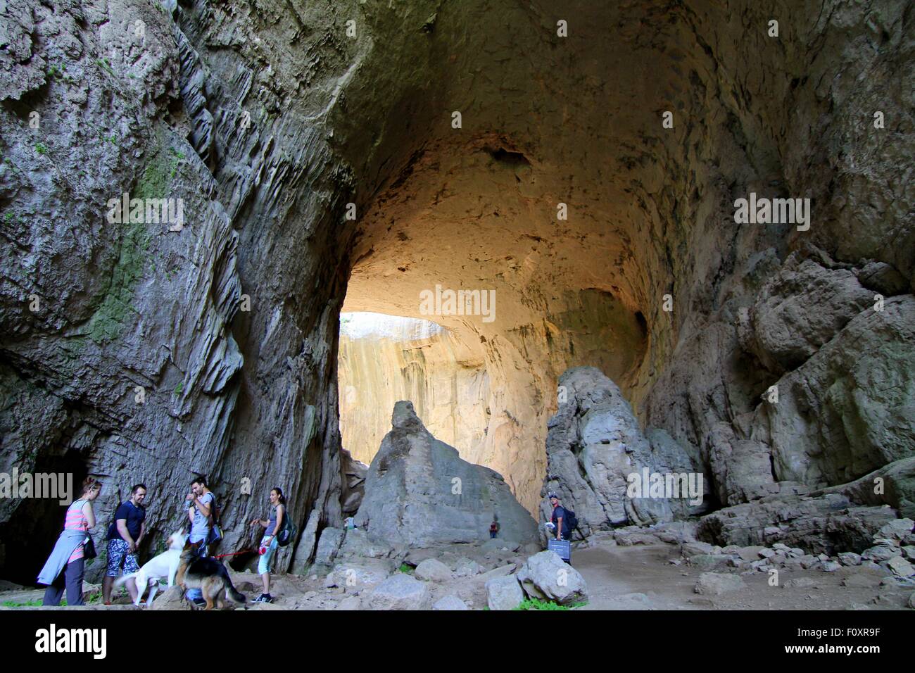 Bungee jumpers hurl themselves over the Prohodna cave entrance and ...