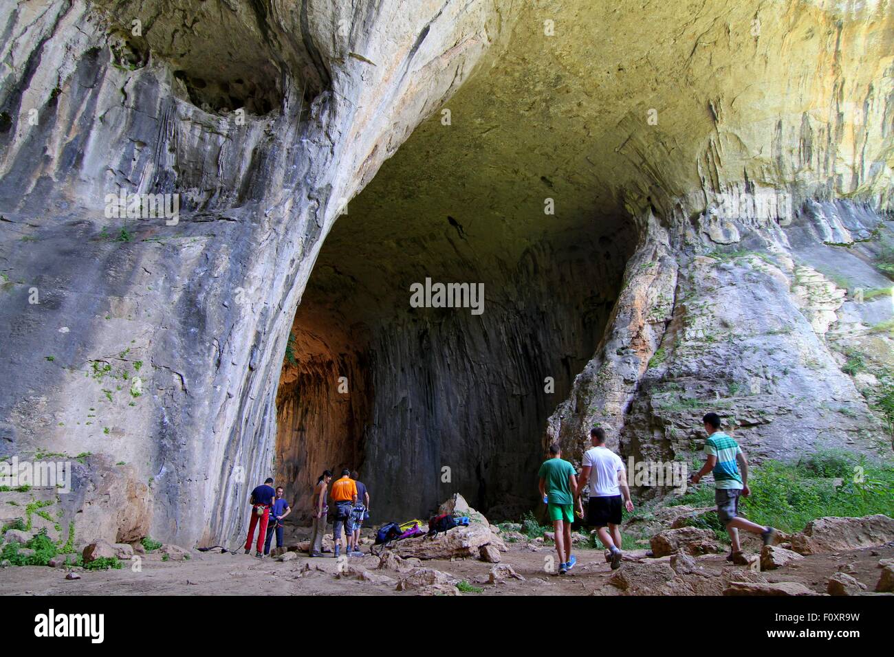 Bungee jumpers hurl themselves over the Prohodna cave entrance and ...