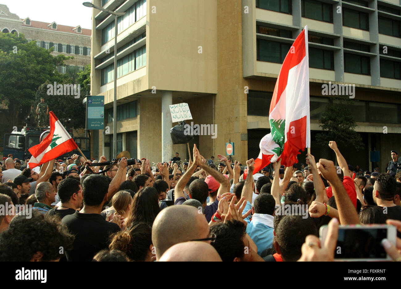 Beirut, Lebanon. 22nd Aug, 2015. Lebanese protesters hold banners and ...