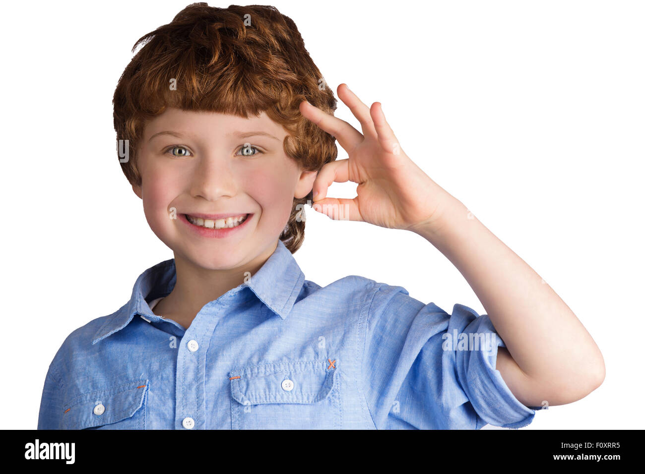 Handsome smiling boy showing OK sign with his hand. Isolated on white ...