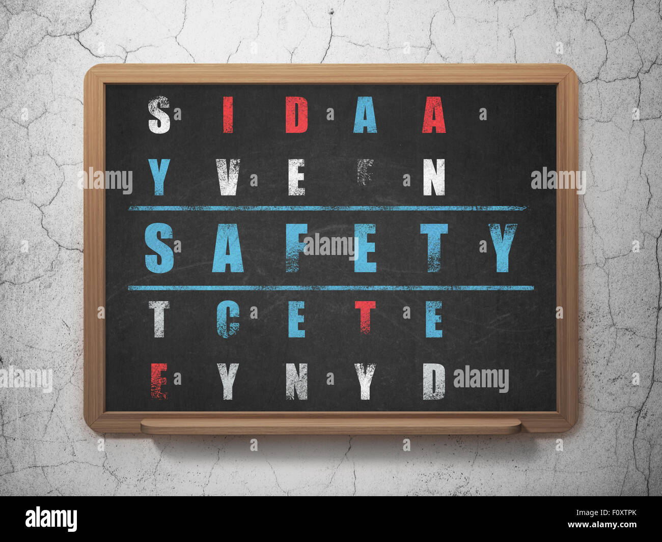 Safety concept: Painted blue word Safety in solving Crossword Puzzle on ...
