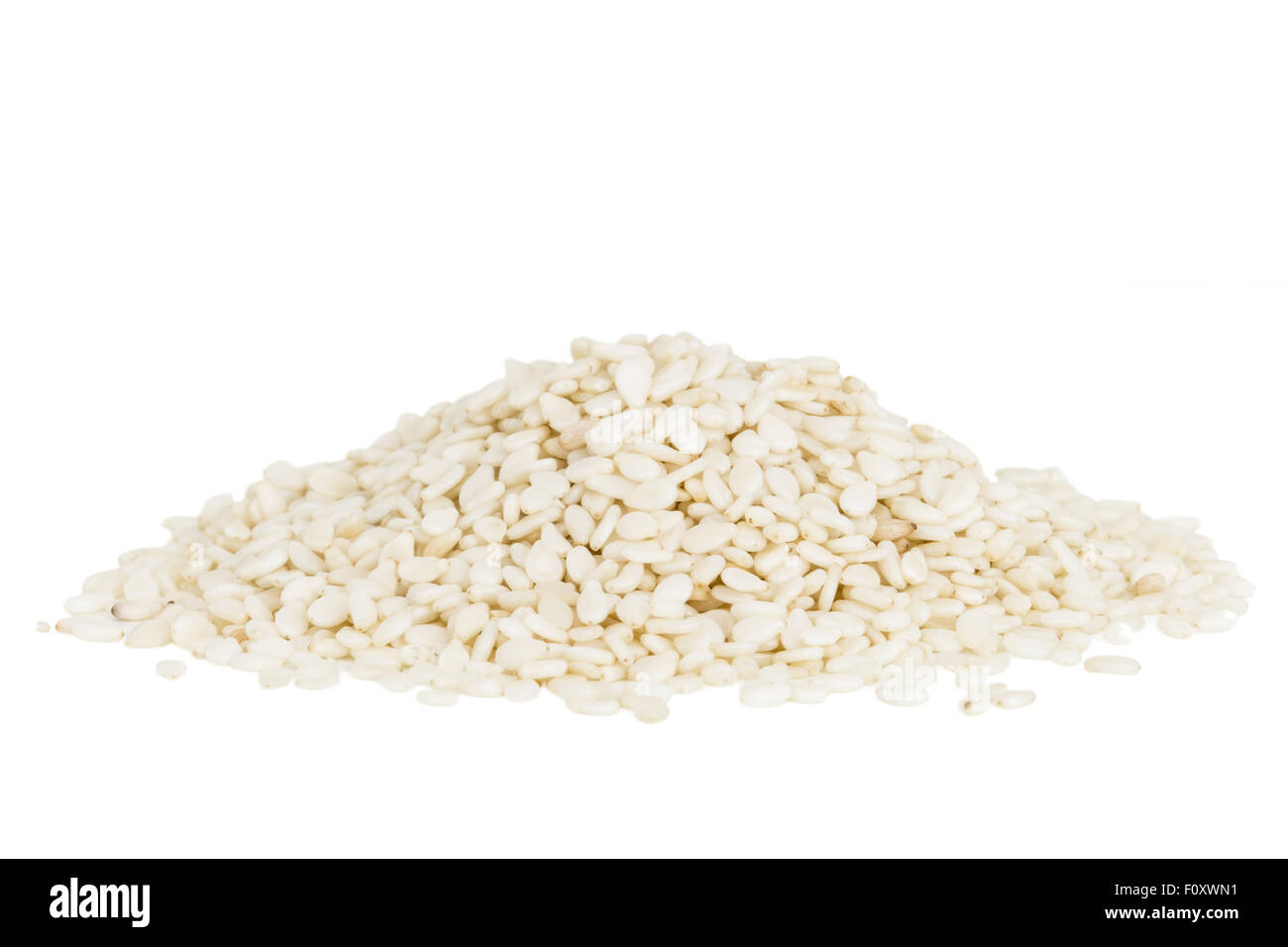 Heap of sesame seeds with no shell, isolated on white background Stock ...