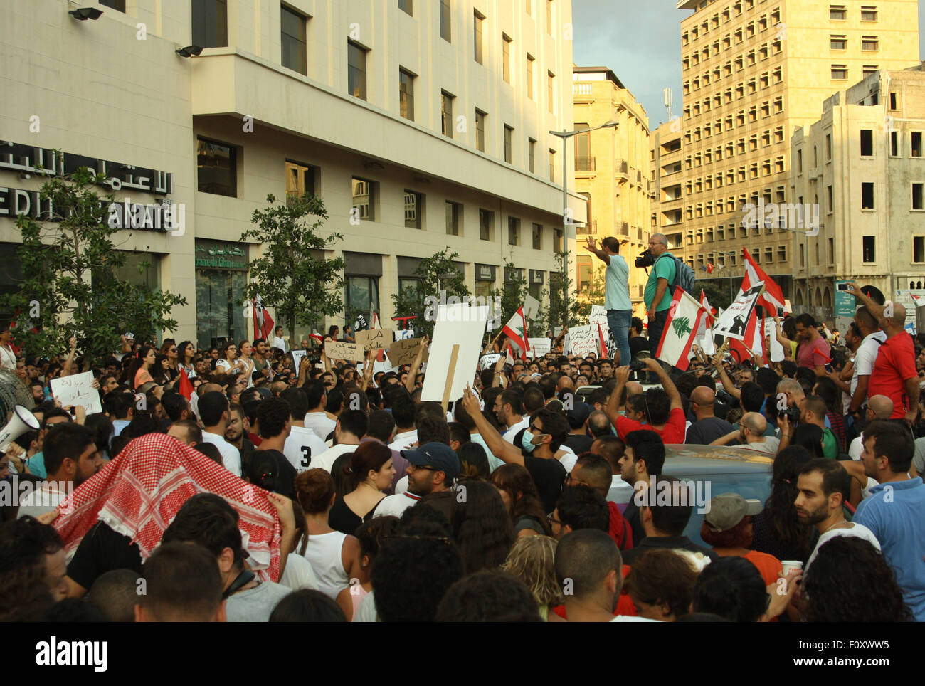 Beirut, Lebanon. 22nd Aug, 2015. Lebanese protesters hold banners and ...