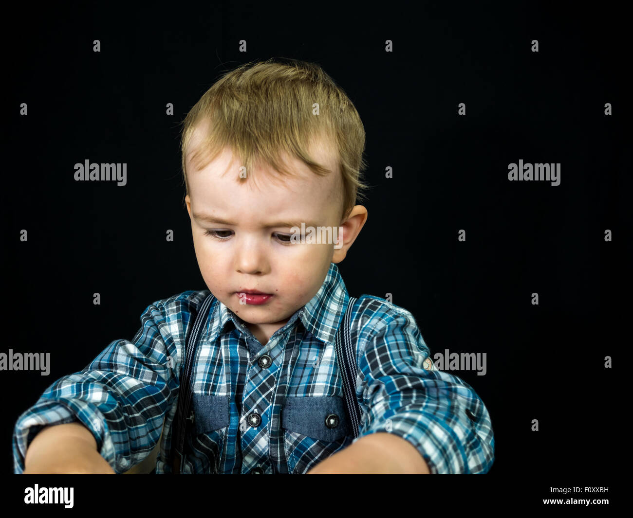 baby boy. Studio photo with black background Stock Photo - Alamy