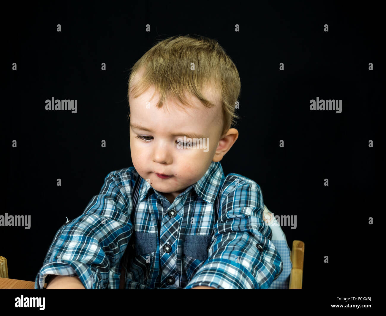 baby boy. Studio photo with black background Stock Photo - Alamy