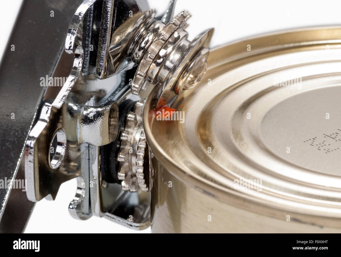 The can opener opens can close up Stock Photo - Alamy