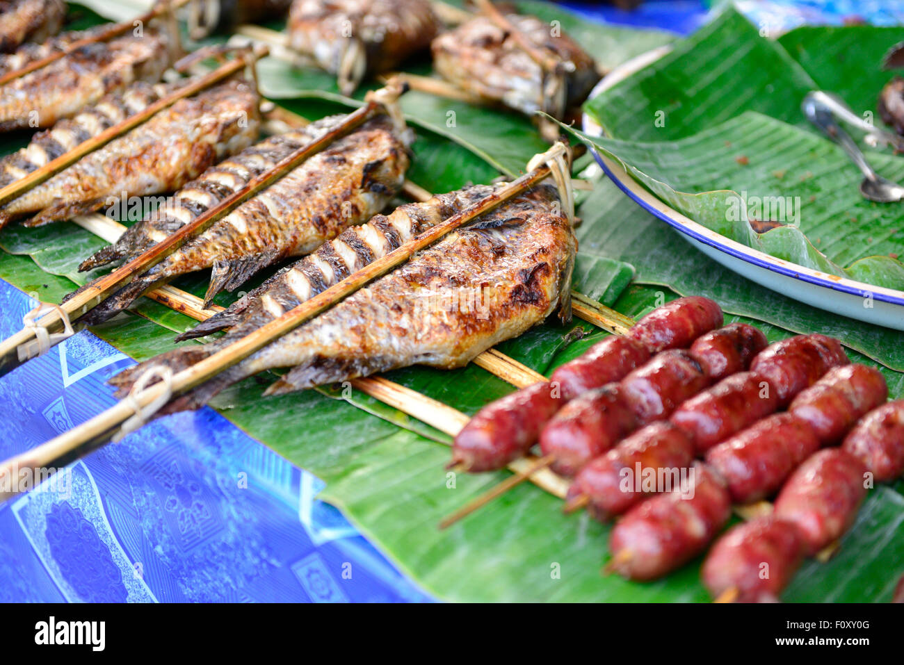 Grilled fish and sausages Stock Photo - Alamy