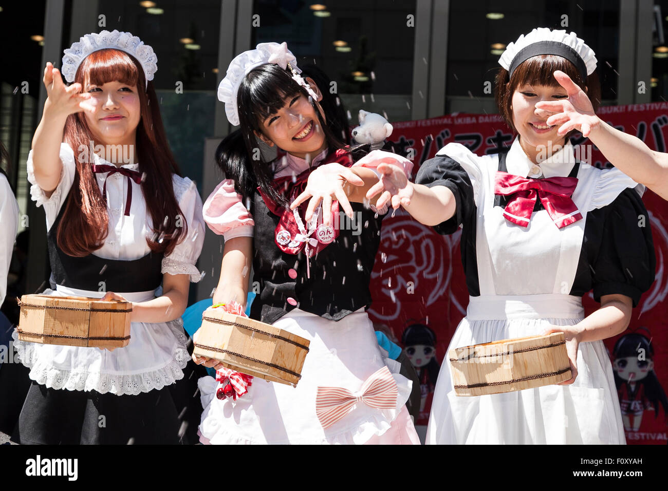 Maid cafe waitresses sprinkle water during the ''Uchimizukko Big ...