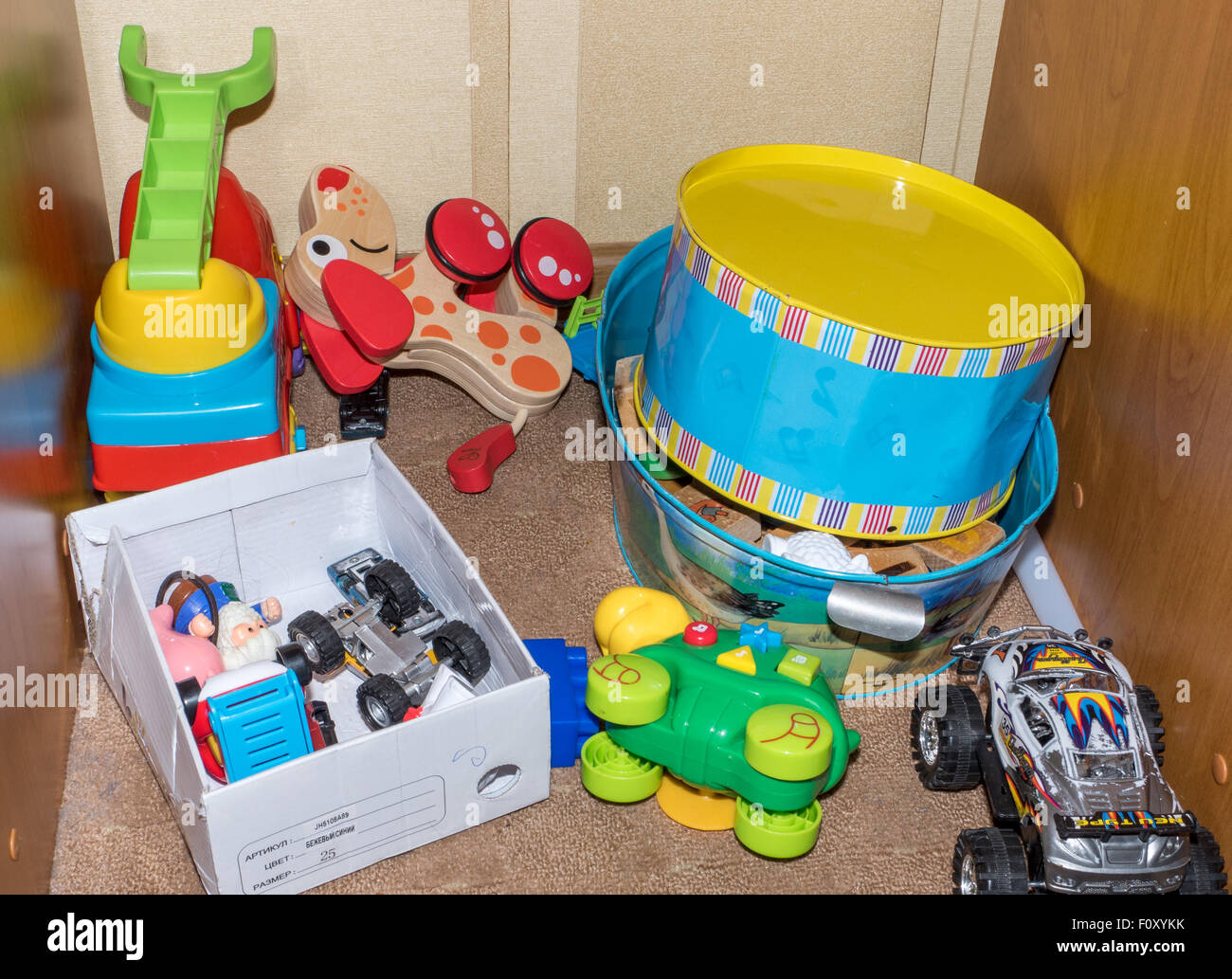 kids toys on a the floor with brown background Stock Photo - Alamy