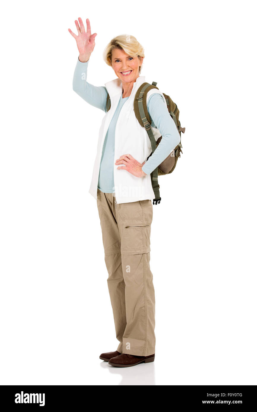 happy middle aged female tourist waving goodbye Stock Photo - Alamy