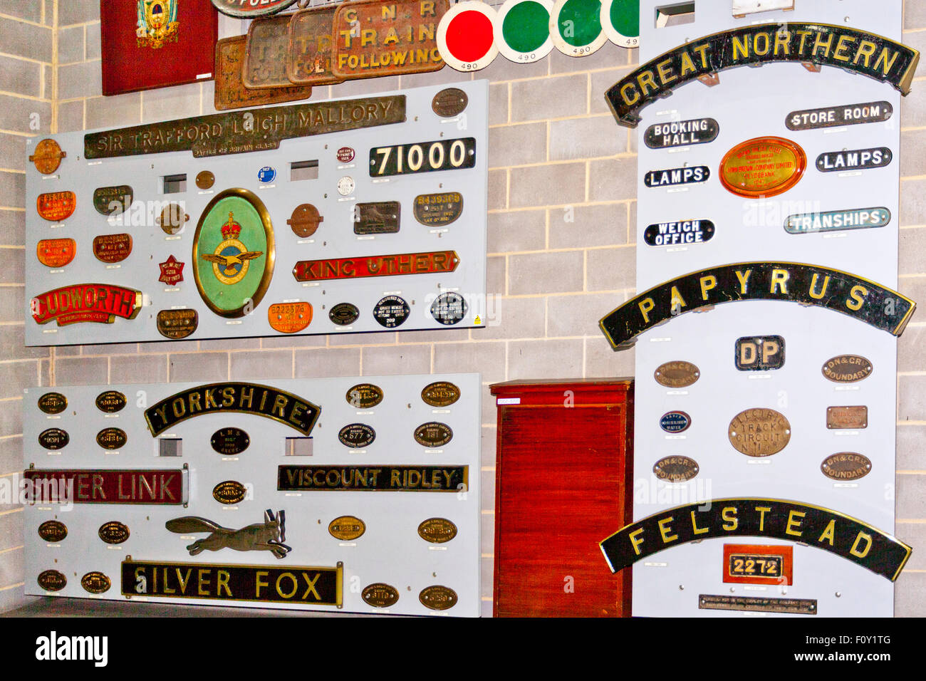A display of historic assorted locomotive nameplates and makers plates ...