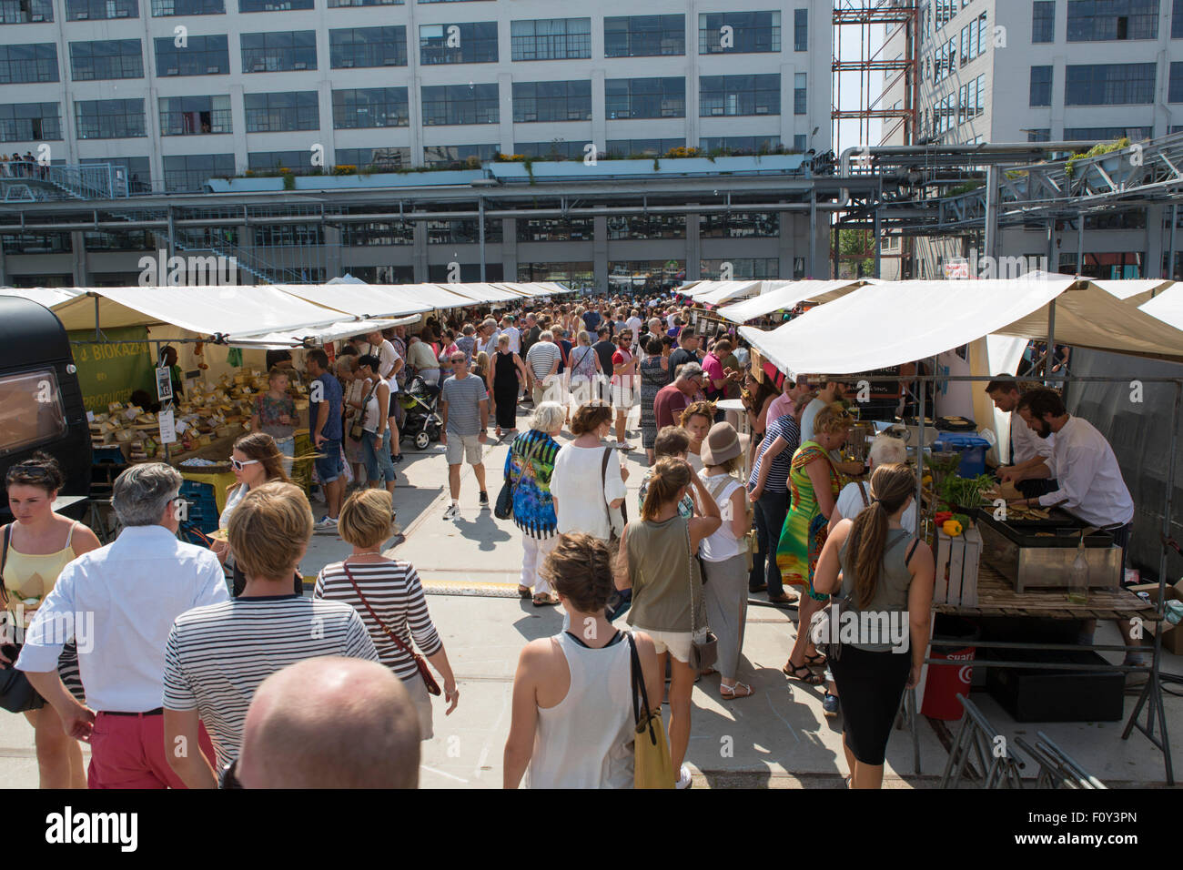 Visitors of the "feel good market" at the former Philips territory ...