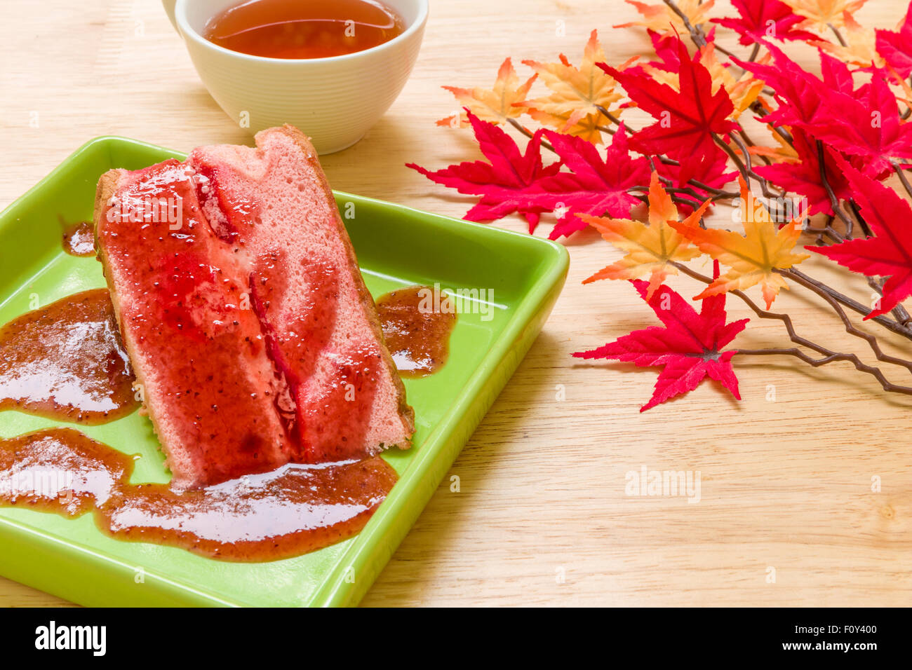 Slice of pink strawberry cake for tea break Stock Photo - Alamy