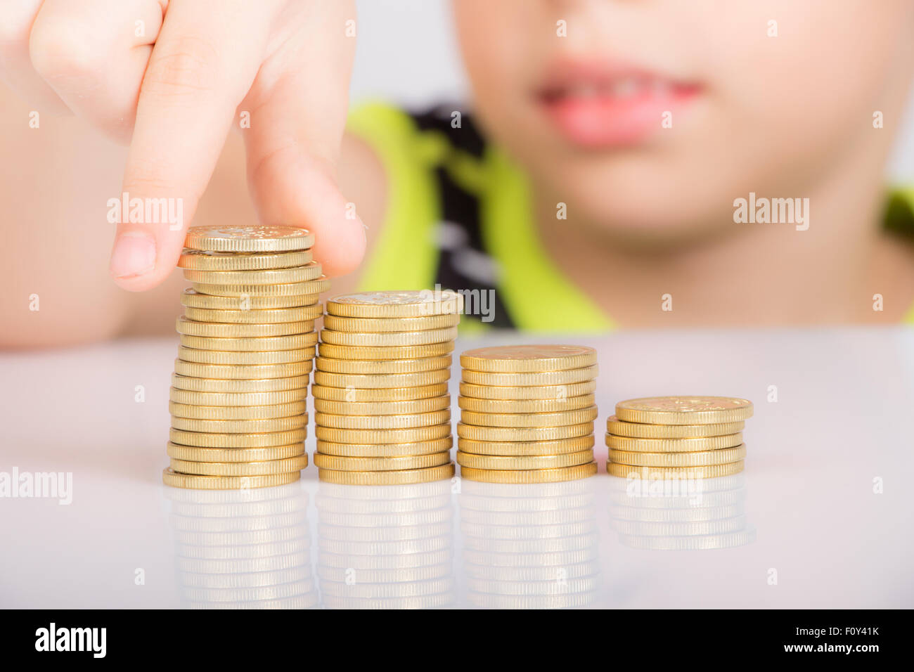 Boy counting coins hi-res stock photography and images - Alamy
