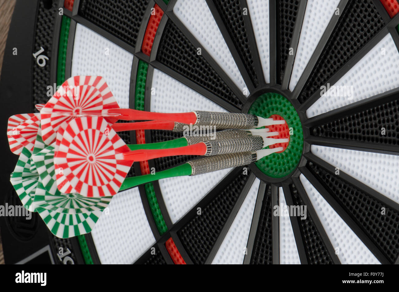Closeup of dart board with darts Stock Photo - Alamy