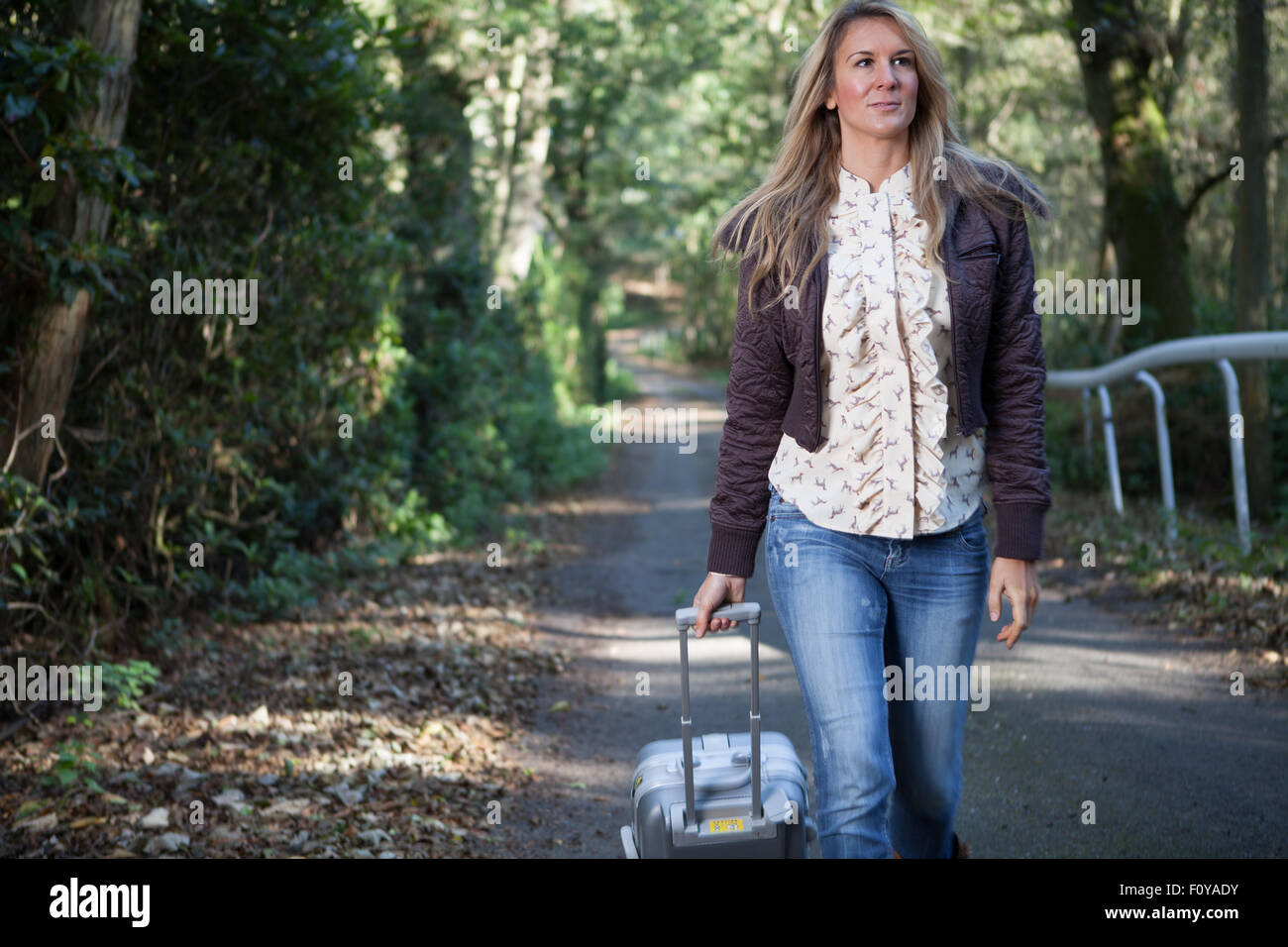 Woman walking home alone hi-res stock photography and images - Alamy