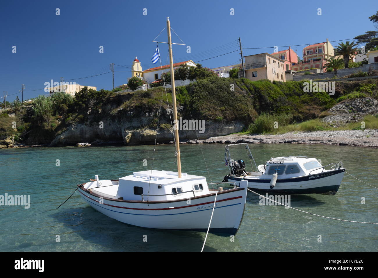 Boats in the old harbour part of the San Stefanos resort in North West ...