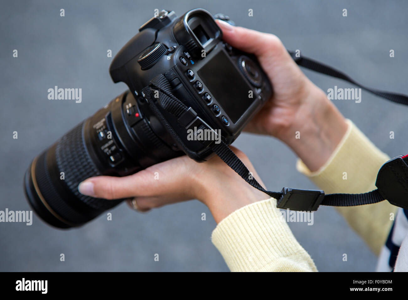 Camera in the hands Stock Photo - Alamy