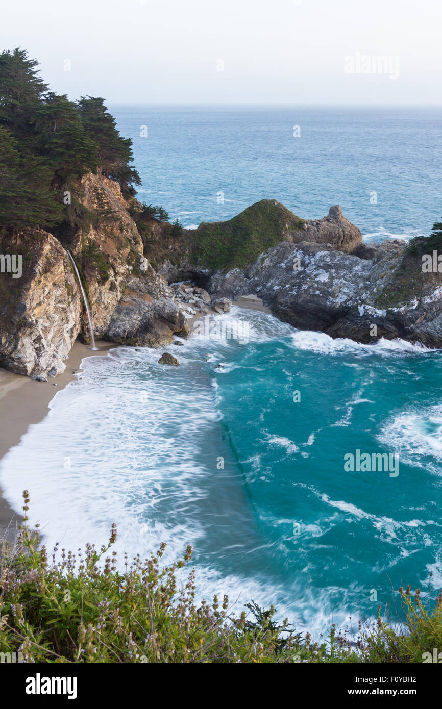Waterfall in Julia Pfeifer Burns State Park at sunset with a soft ...