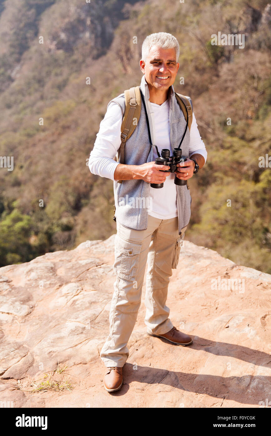handsome senior male hiker standing on top of mountain Stock Photo - Alamy