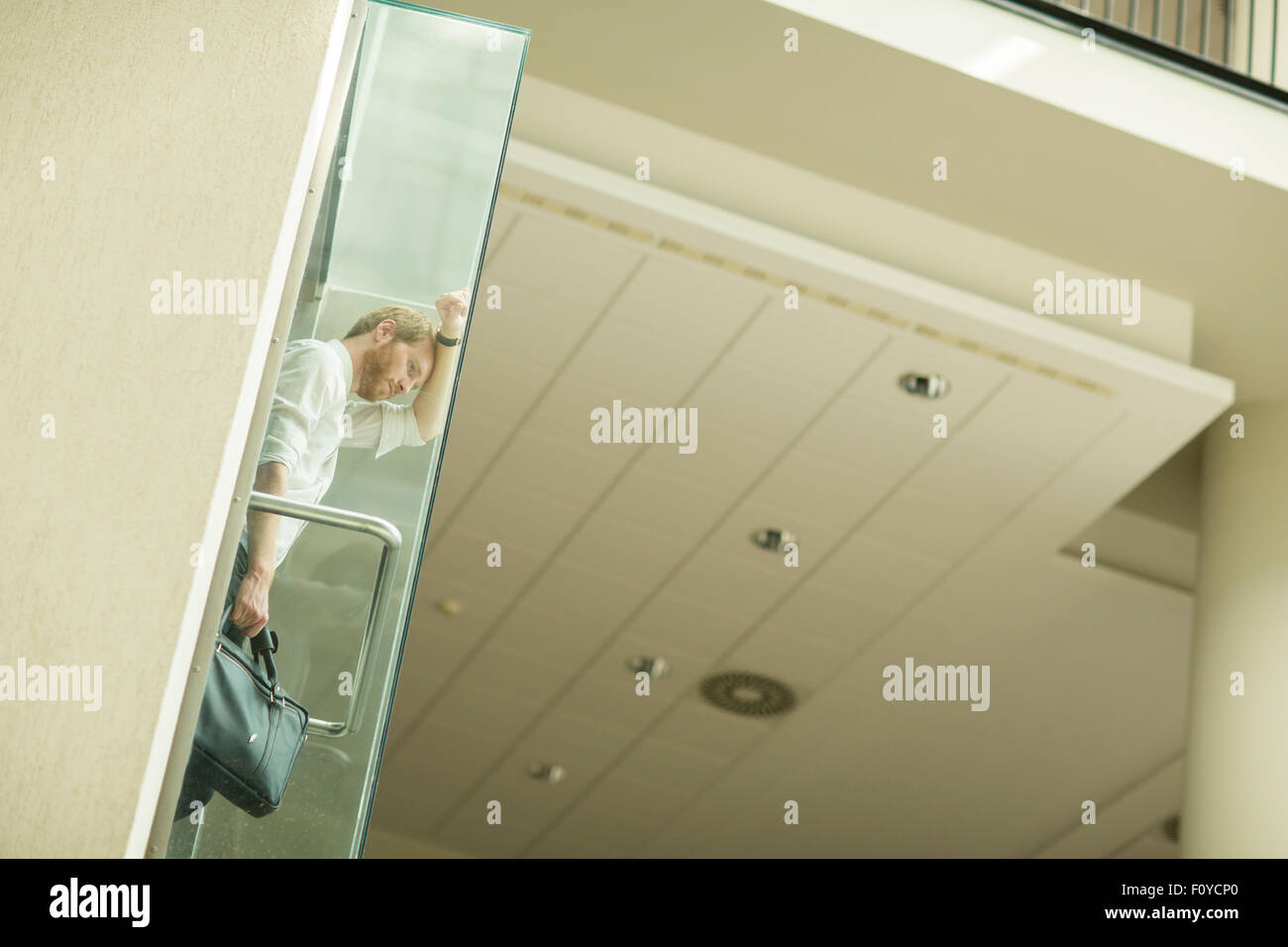 Man lift elevator hi-res stock photography and images - Alamy